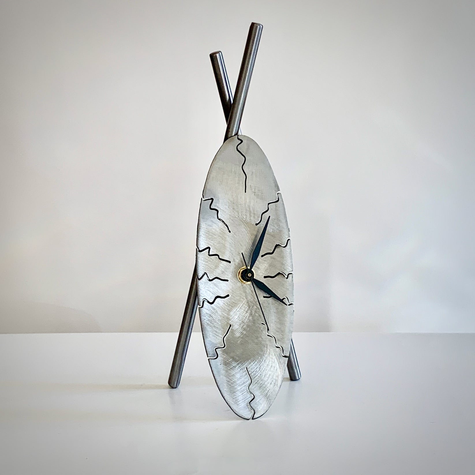 Metallic Evolution Sticks Desk Clock – New Morning Gallery